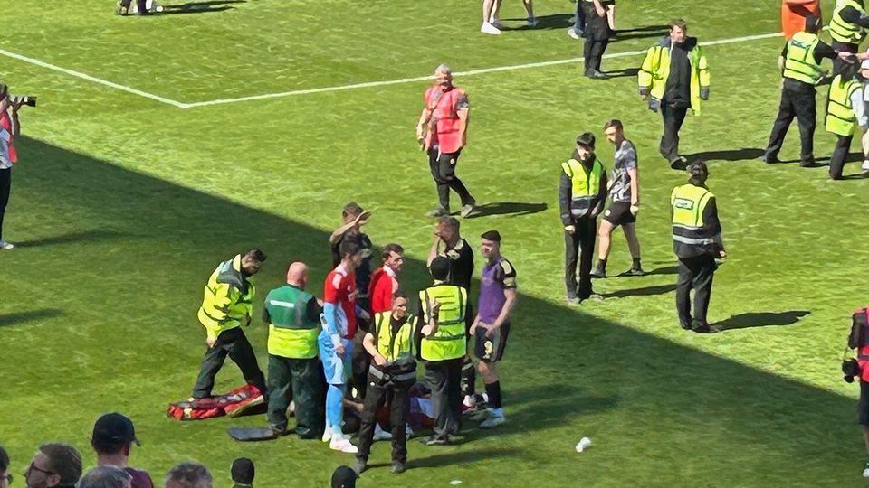 Arrest after Aberdeen player hurt following game at Dundee United.